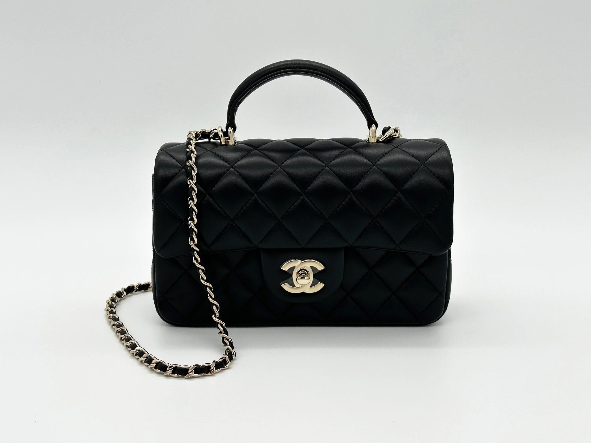 Chanel Mini Flap Bag with Top Handle 21K Black Lambskin Light Gold Hardware